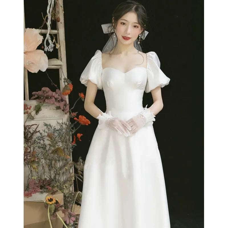 Elegant White Split-hem Bridal Gown With Puff Sleeves on Luulla